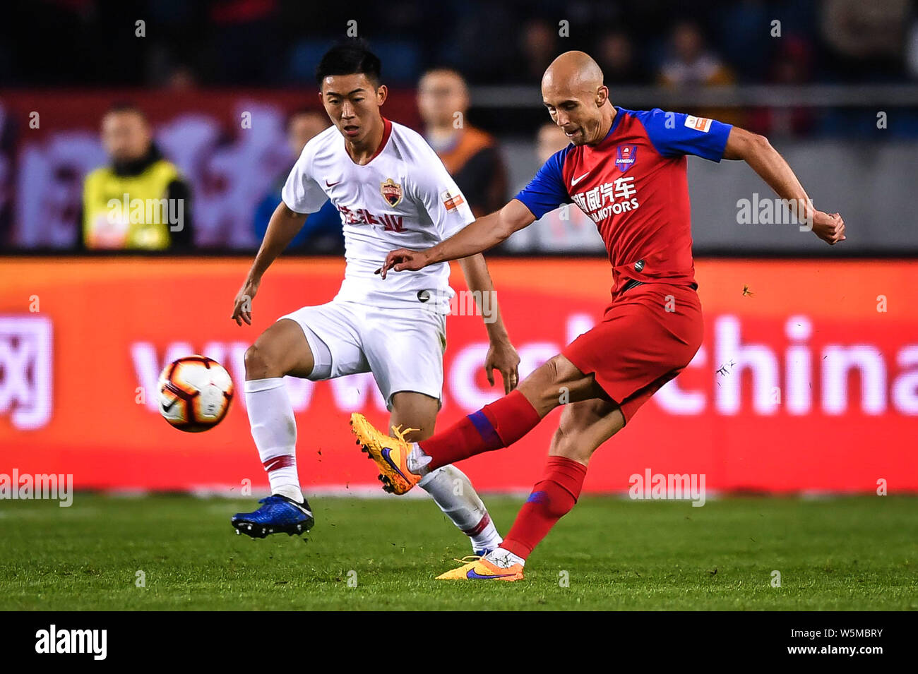 Polish football player Adrian Mierzejewski of Chongqing SWM, right ...