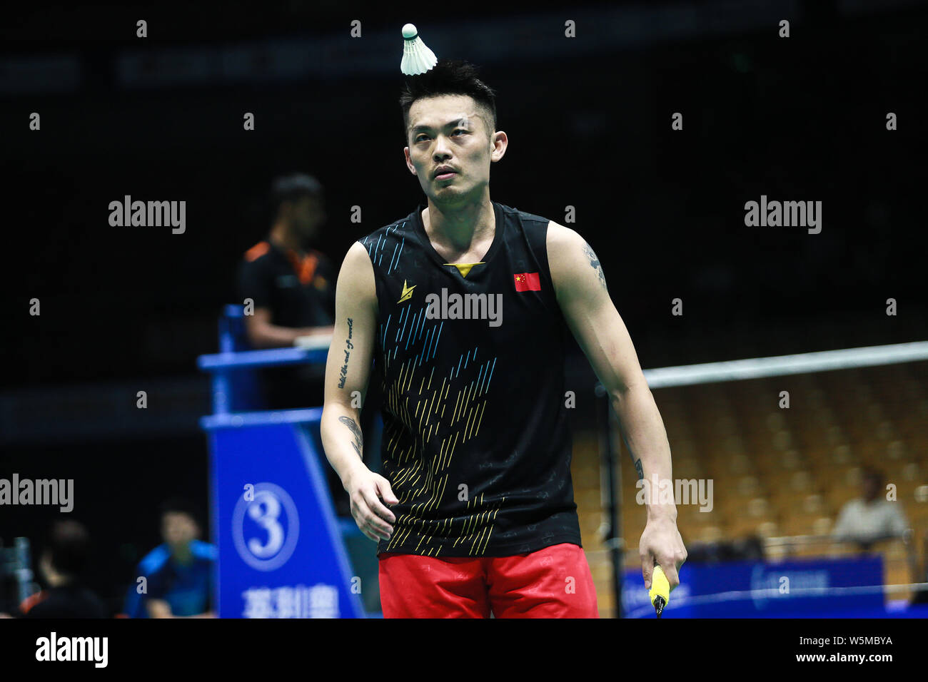 Lin Dan of China reacts while competing against Lu Chia-hung of Chinese ...
