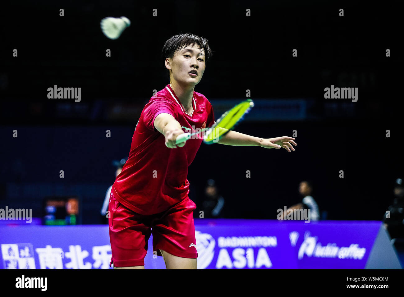 Chen Yufei of China returns a shot to Vu Thi Trang of Vietnam in their ...