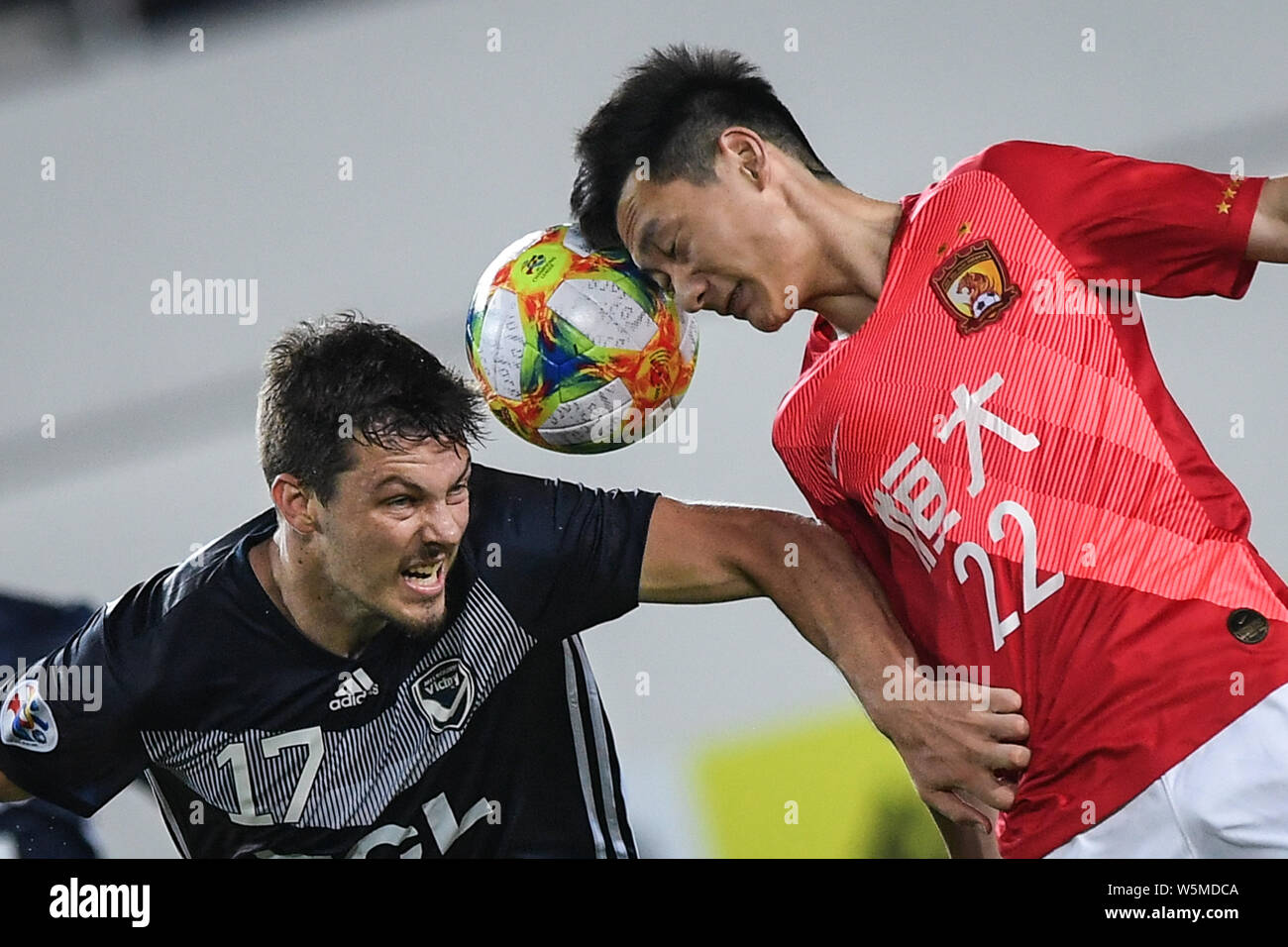 Tang Shi, right, of China's Guangzhou Evergrande challenges James ...