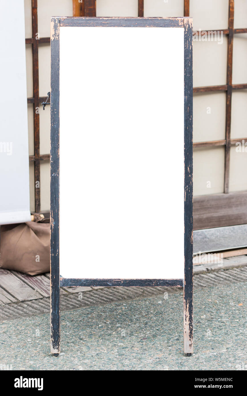 Blank white signboard stand on the storefront Stock Photo - Alamy