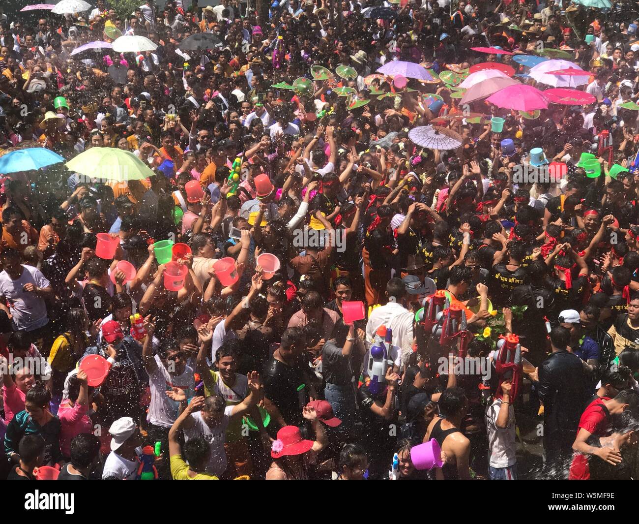 People sprinkle water to each other to celebrate the water-sprinkling ...
