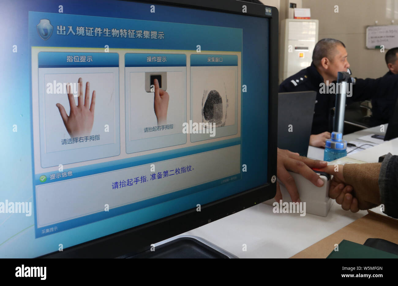 Chinese residents apply for passports at a branch of local exit and ...