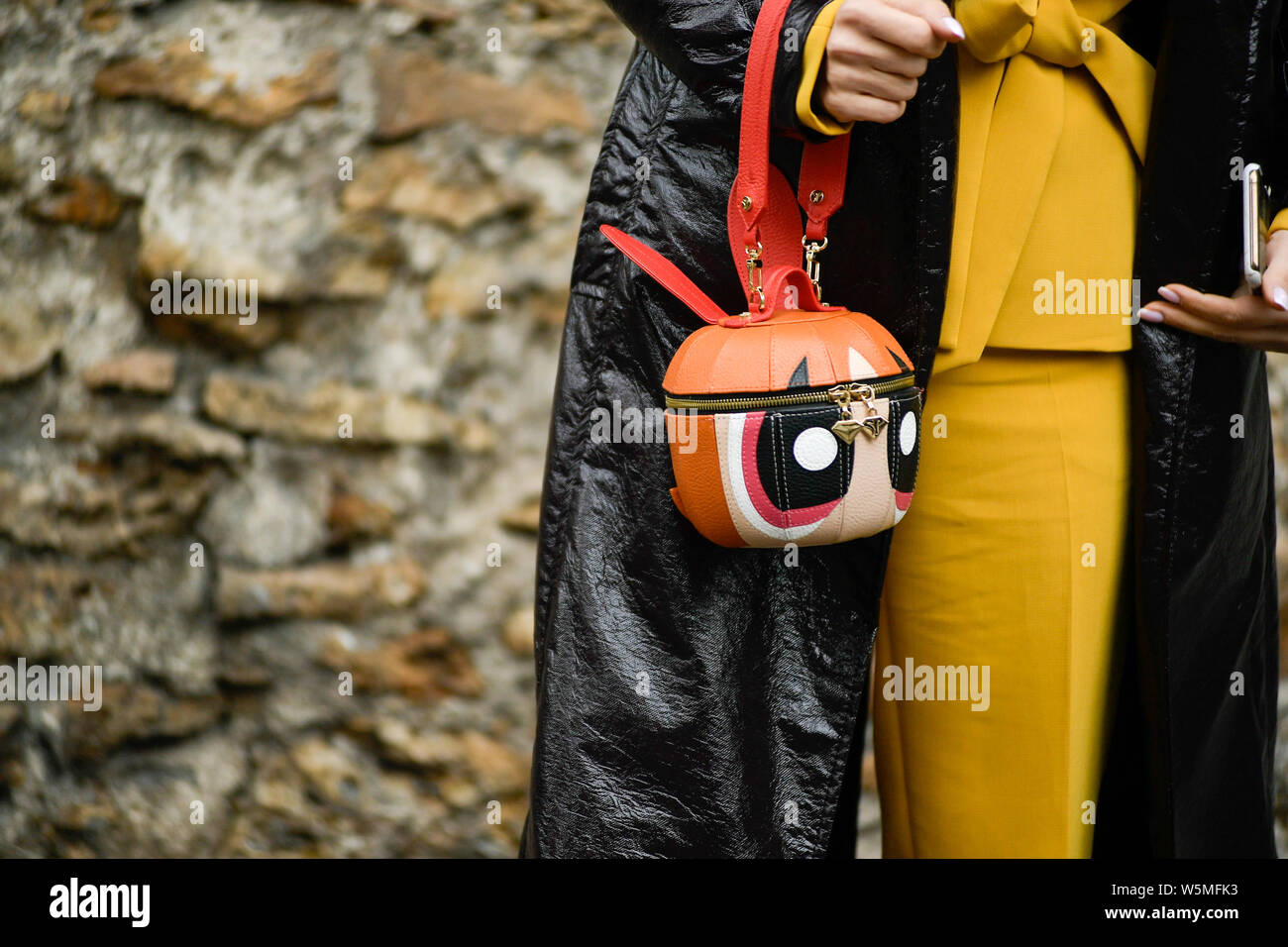 A trendy woman poses for street snaps during the Paris Fashion Week ...