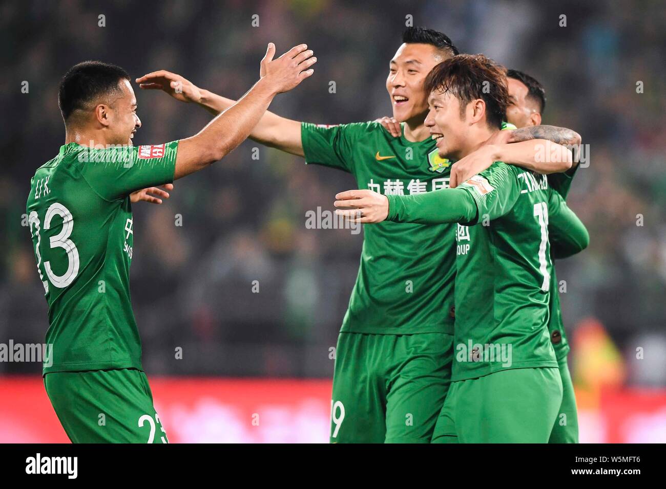 Yu Dabao, center, of Beijing Sinobo Guoan celebrates with his teammates ...