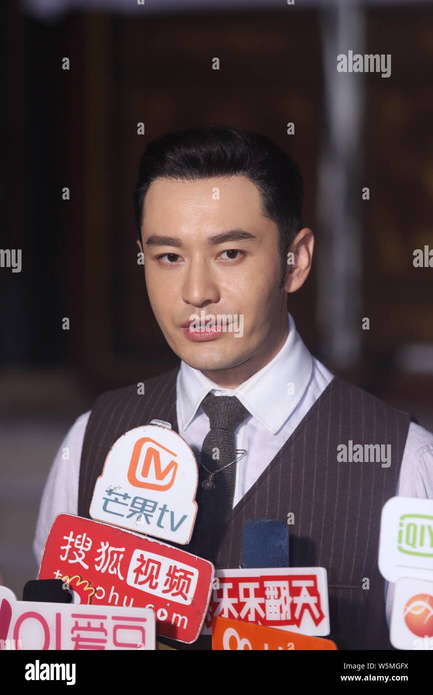 Chinese actor Huang Xiaoming poses during a filming session on set of ...