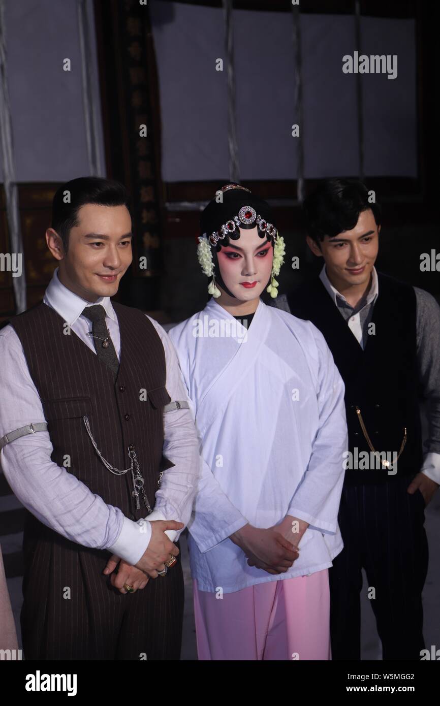 Chinese actors Huang Xiaoming, left, and Yin Zheng, center, pose during ...