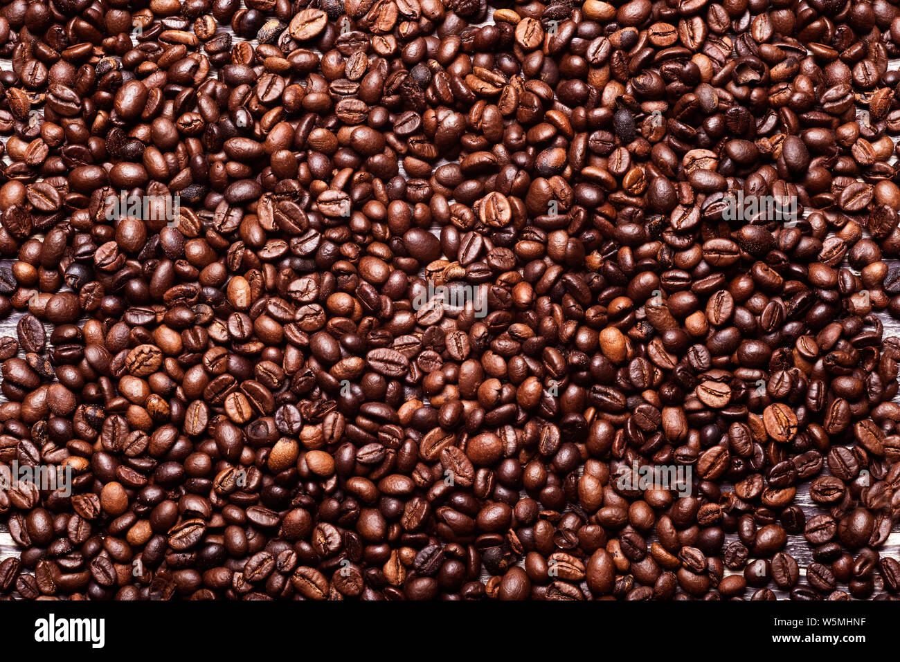 Coffee beans on the table background Stock Photo - Alamy