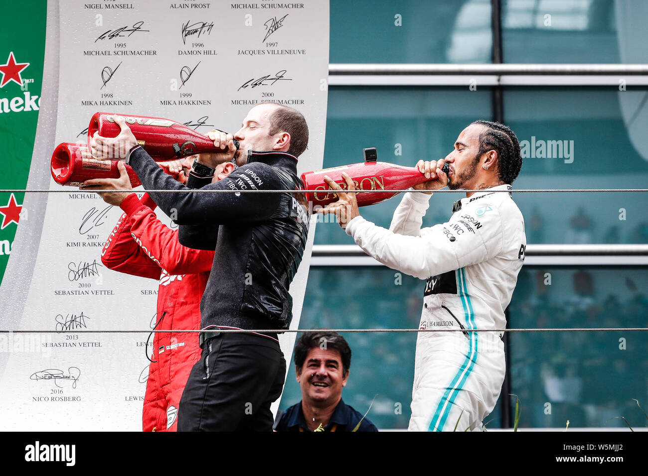 British Formula One driver Lewis Hamilton of Mercedes, right ...