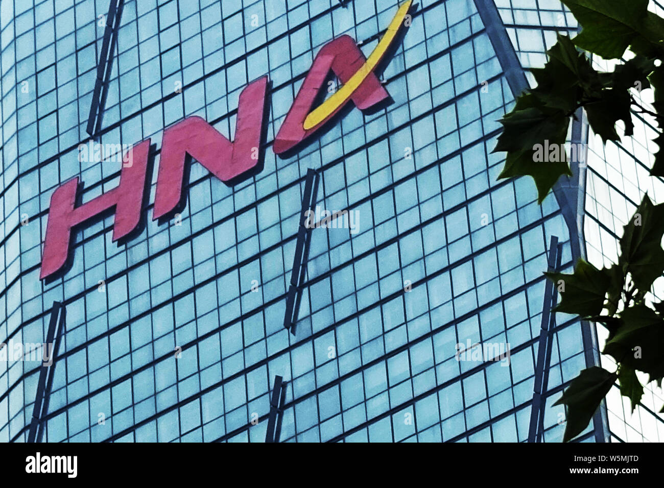 --FILE--A logo of HNA is pictured on an office building of HNA Group in ...