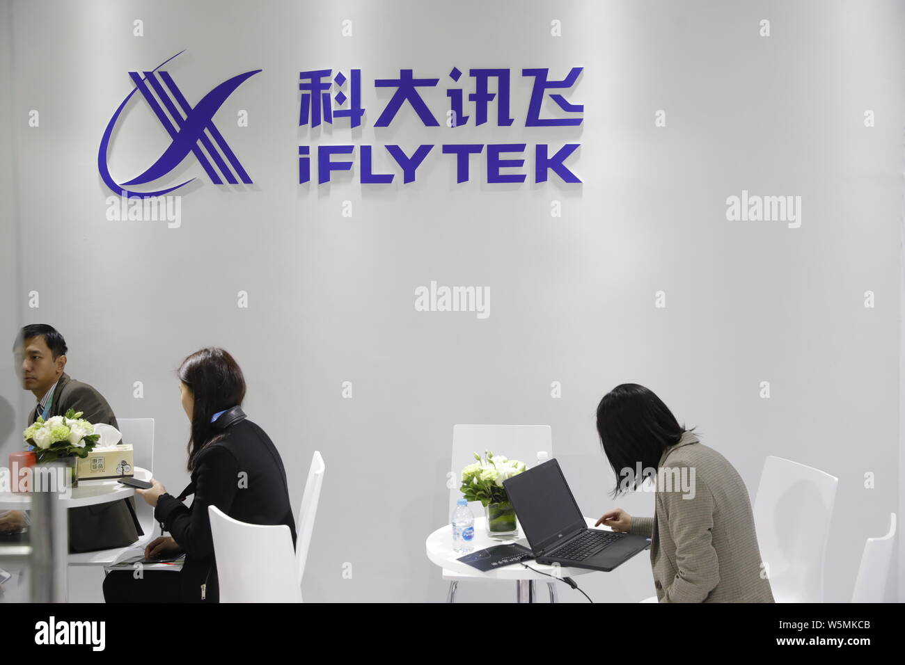 --FILE--People visit the stand of iFlytek, China's largest voice recognition company during the ...
