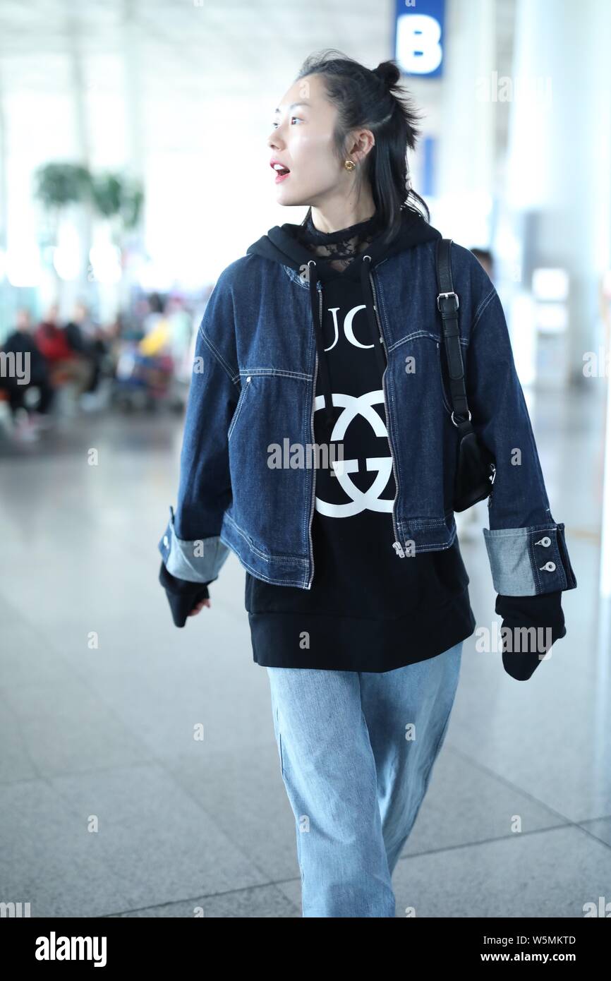 Chinese model Liu Wen arrives at the Beijing Capital International ...