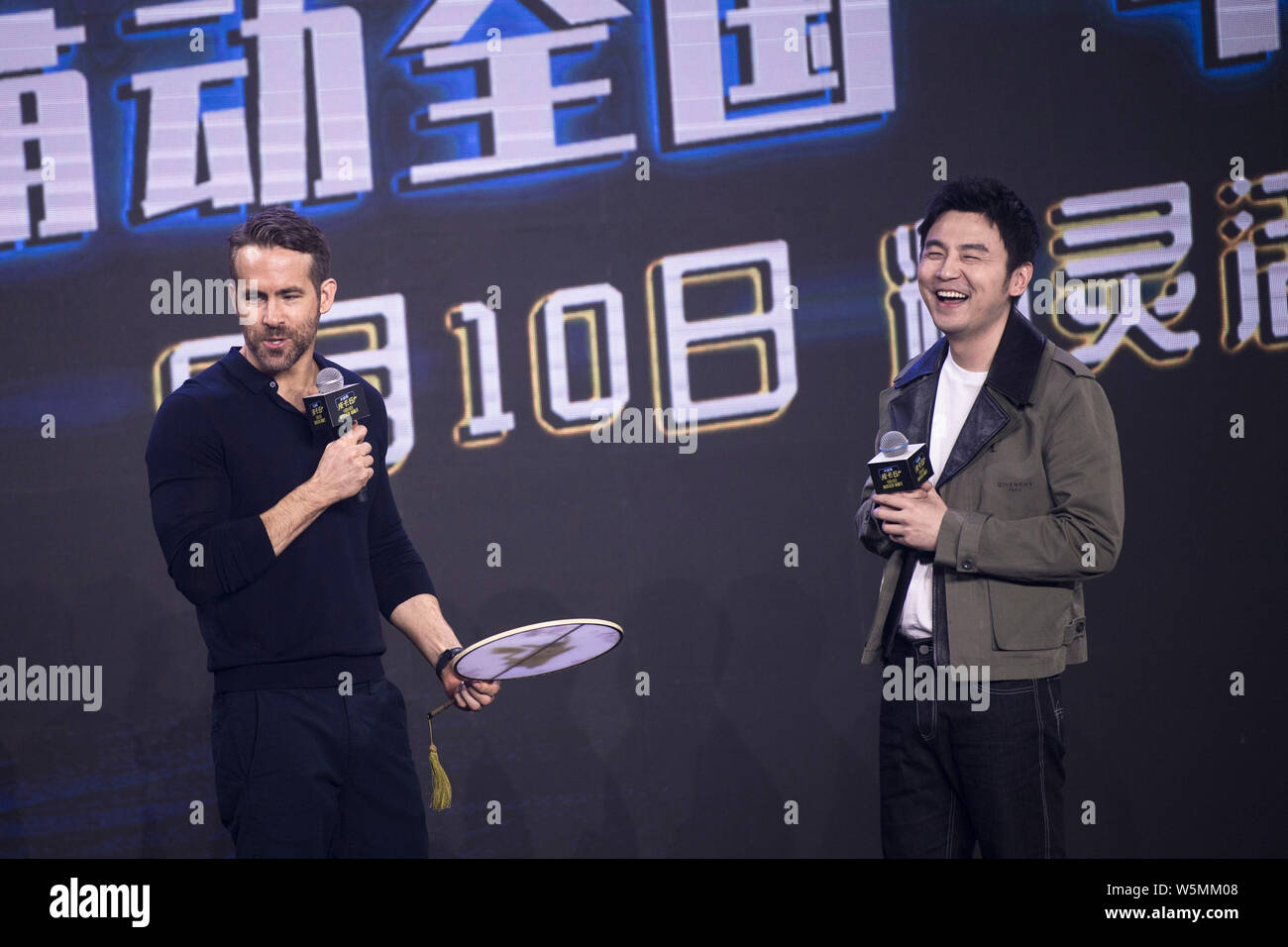 Canadian-American actor Ryan Reynolds, left, and Chinese actor Lei ...