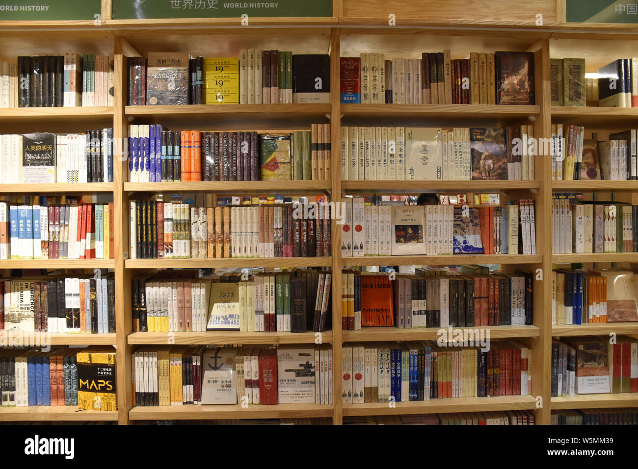 Customers read books at a new bookstore stacked with the innovative ...