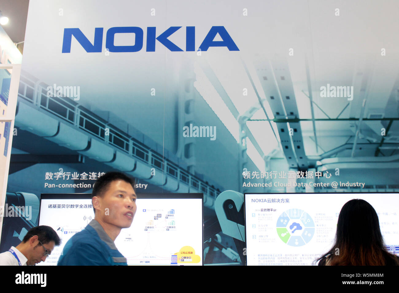 --FILE--People visit the stand of Nokia during an exhibition in ...