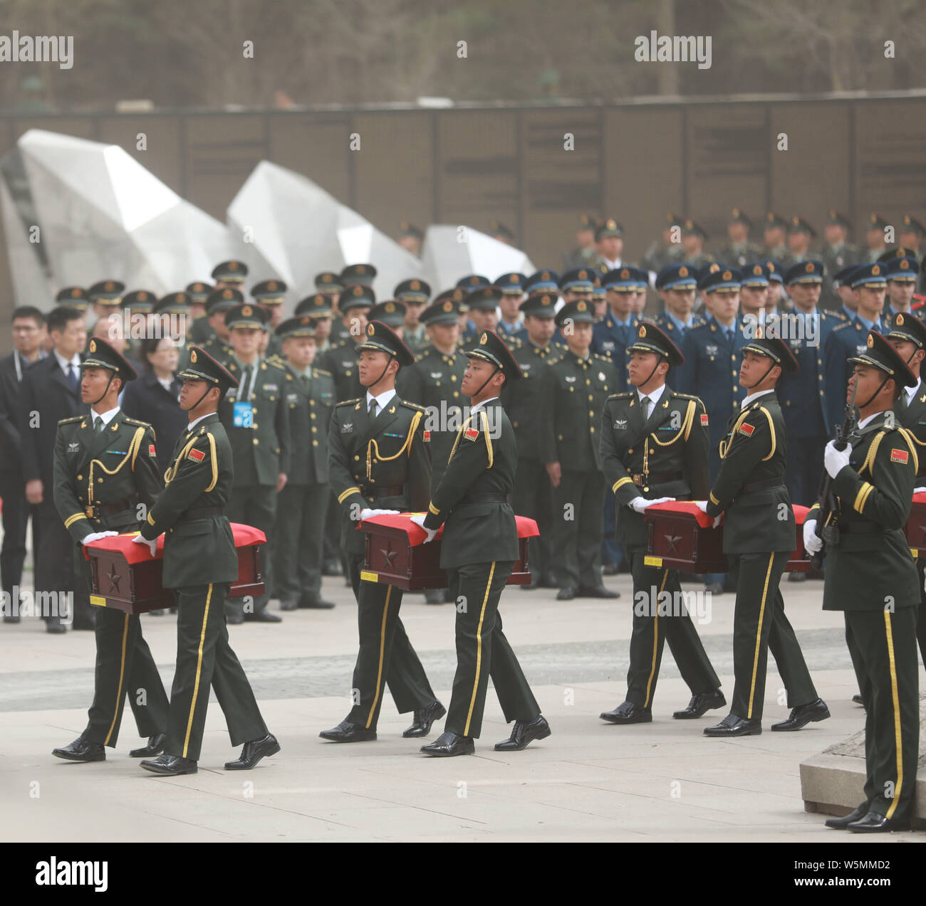 Chinese PLA soldiers attend a burial ceremony for the remains of 10 ...