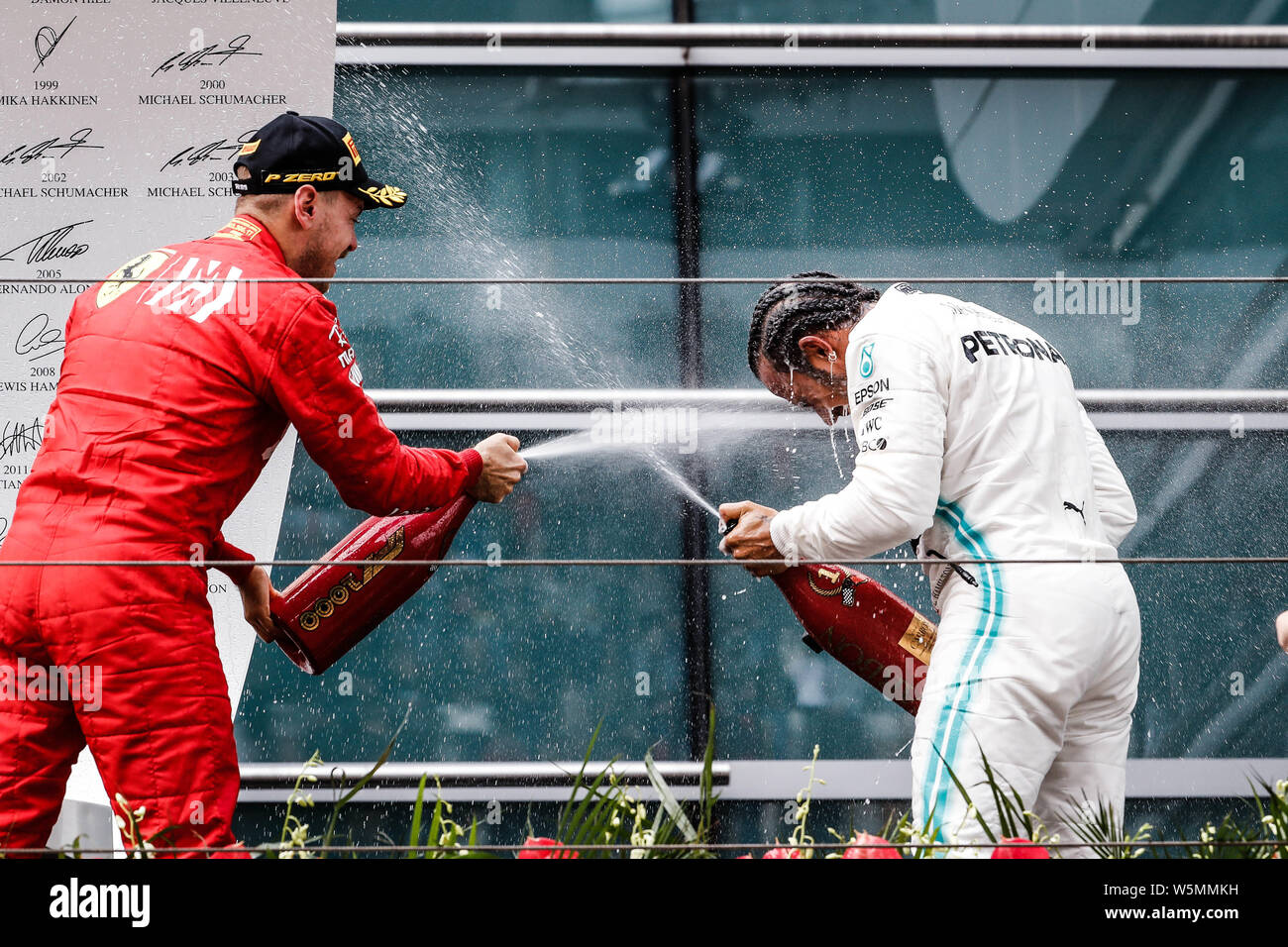 British Formula One driver Lewis Hamilton of Mercedes, right, and ...