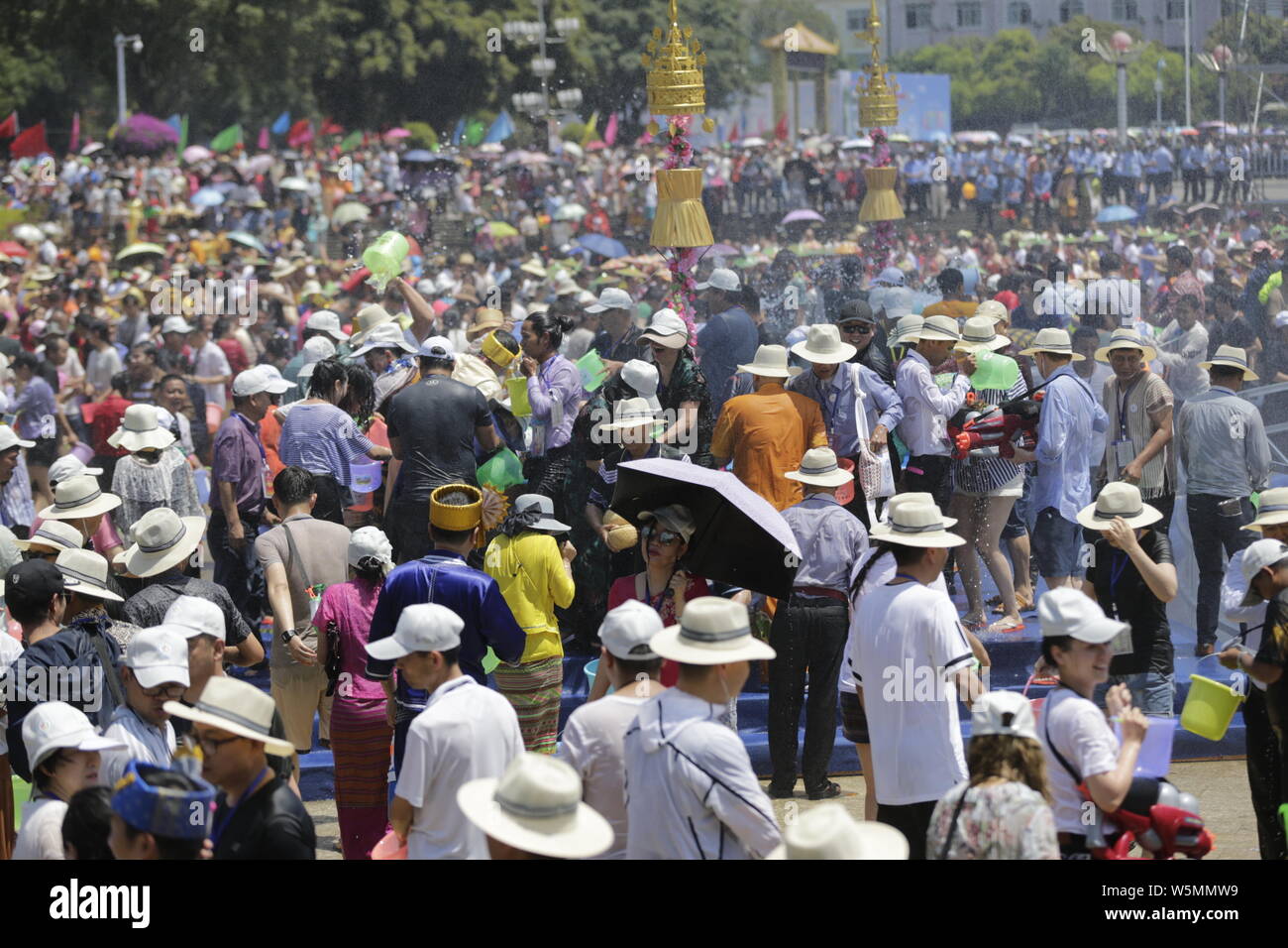 People sprinkle water to each other to celebrate the water-sprinkling ...