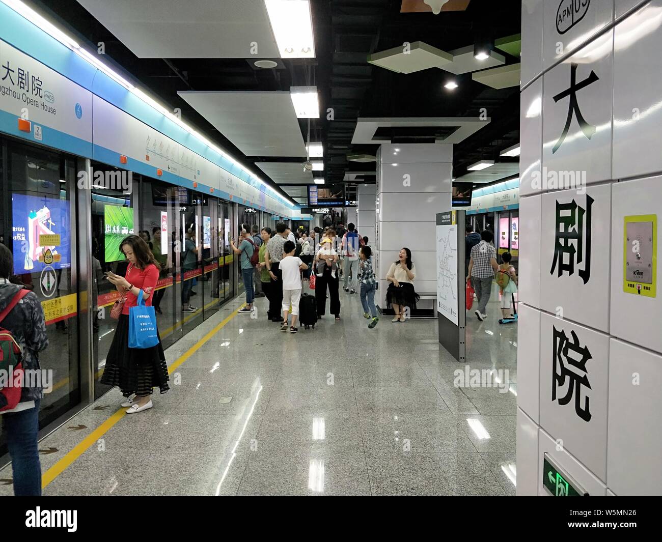 Passengers wait for their subway trains of Zhujiang New Town Automated ...