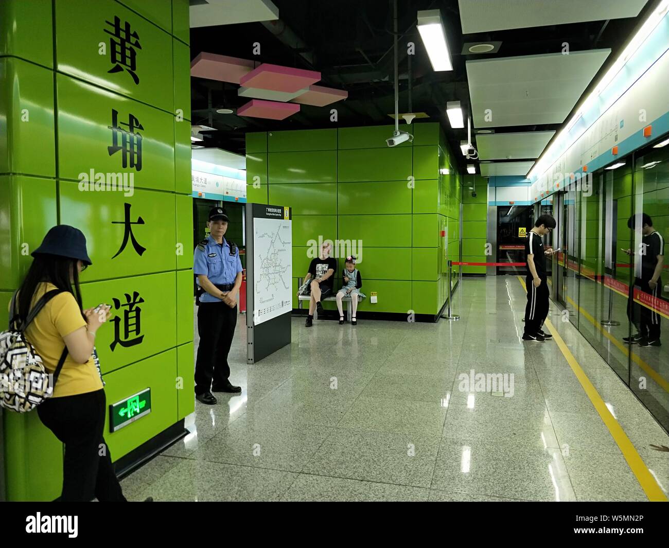 Passengers wait for their subway trains of Zhujiang New Town Automated ...