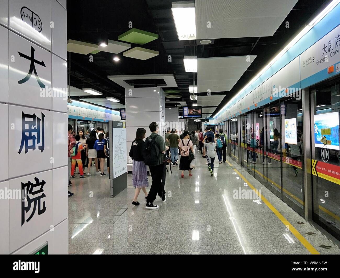 Passengers wait for their subway trains of Zhujiang New Town Automated ...