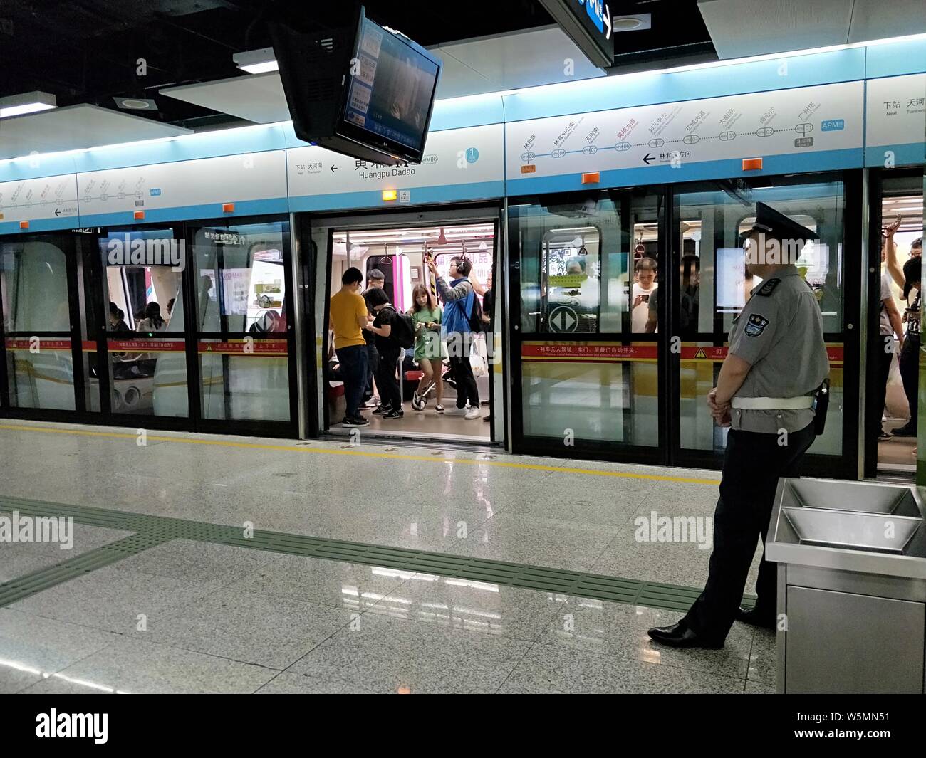 Passengers wait for their subway trains of Zhujiang New Town Automated ...