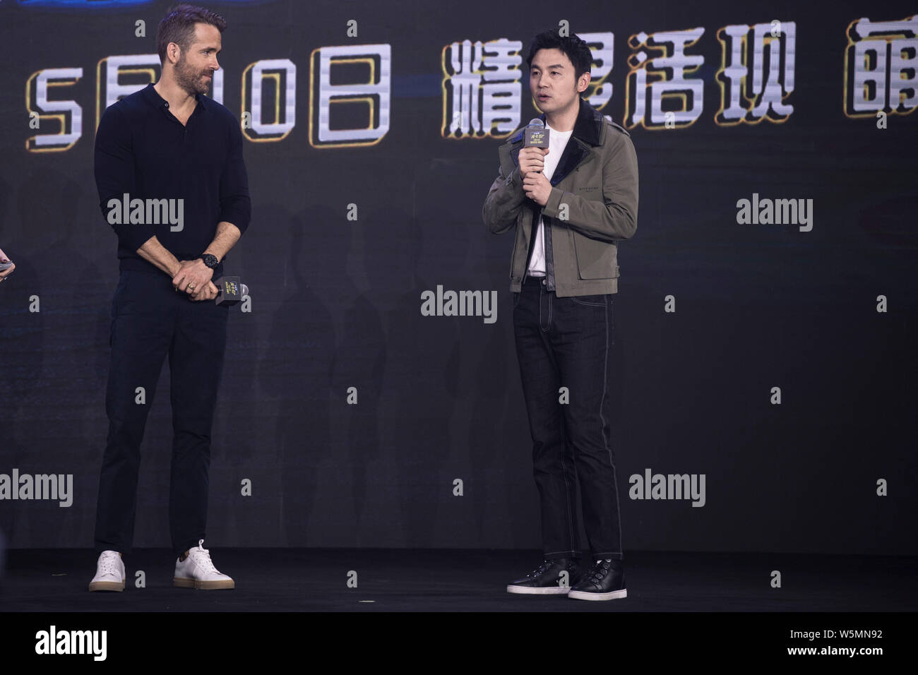 Canadian-American actor Ryan Reynolds, left, and Chinese actor Lei ...