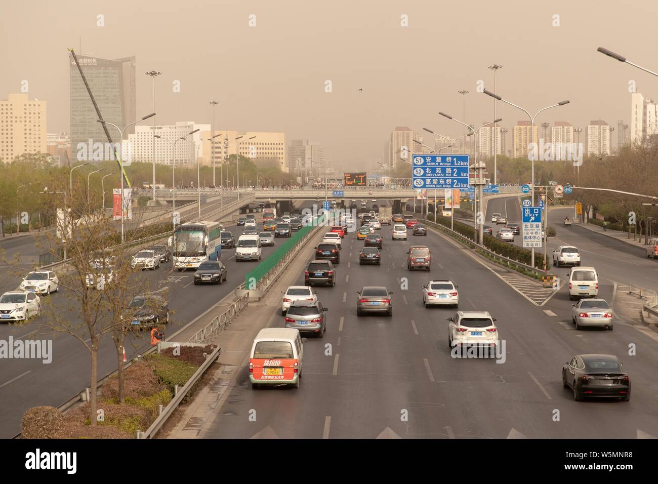 Cars drive on a road in heavy dust in Beijing, China, 5 April 2019 ...
