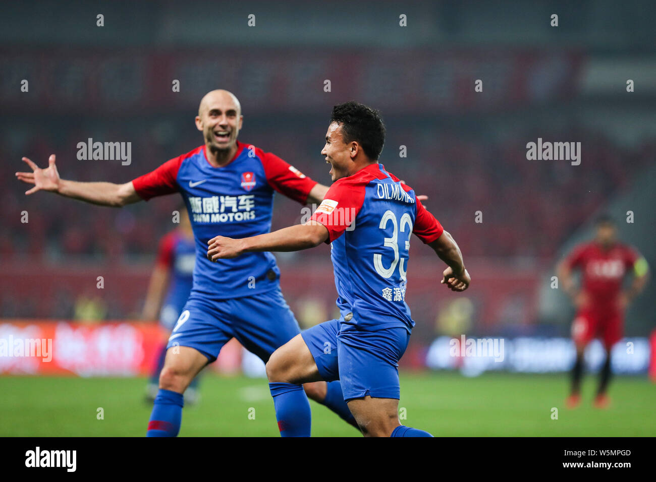 Polish football player Adrian Mierzejewski of Chongqing SWM F.C., left ...
