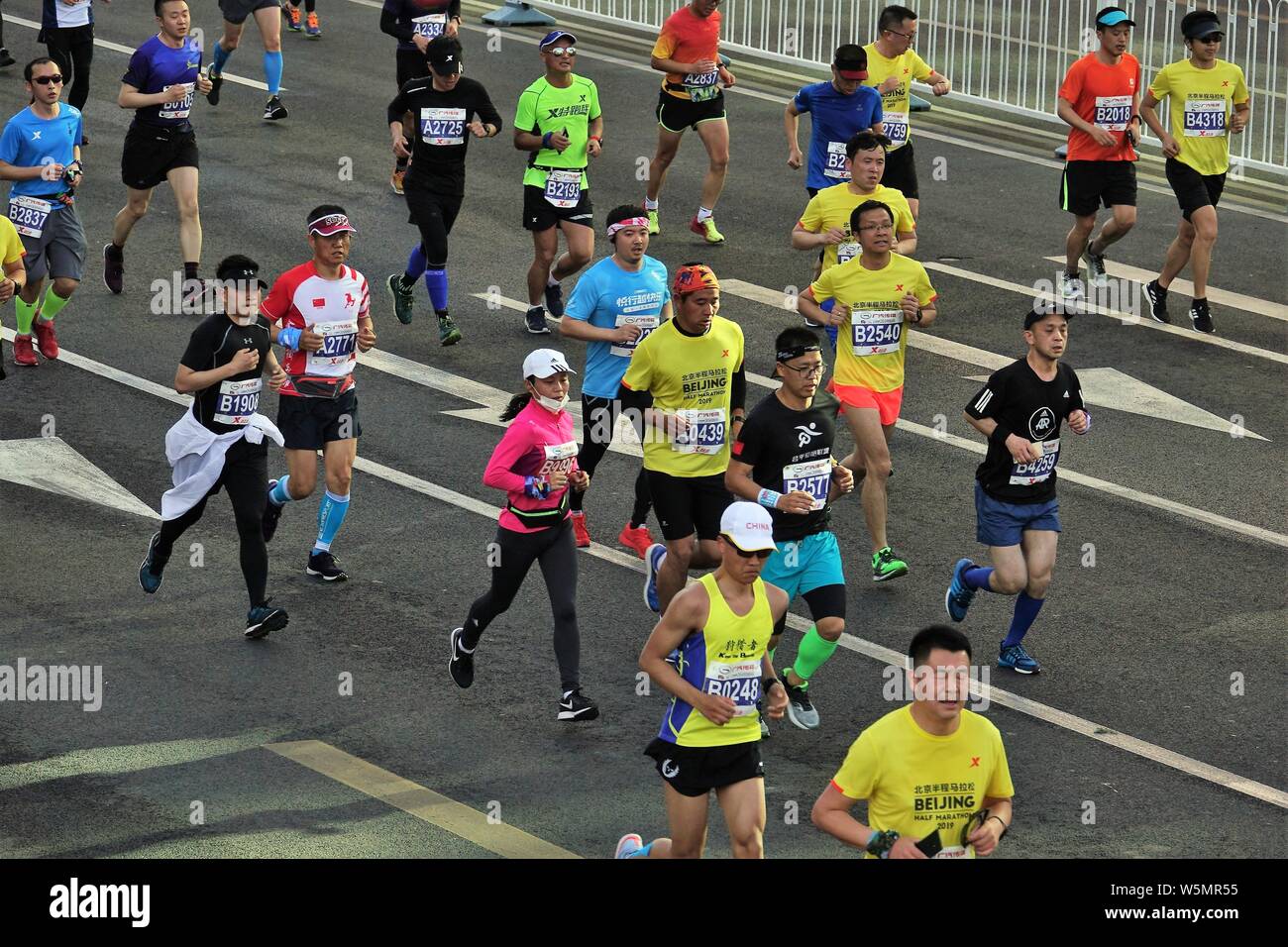 Participants run from the starting line during the 2019 Beijing Half ...