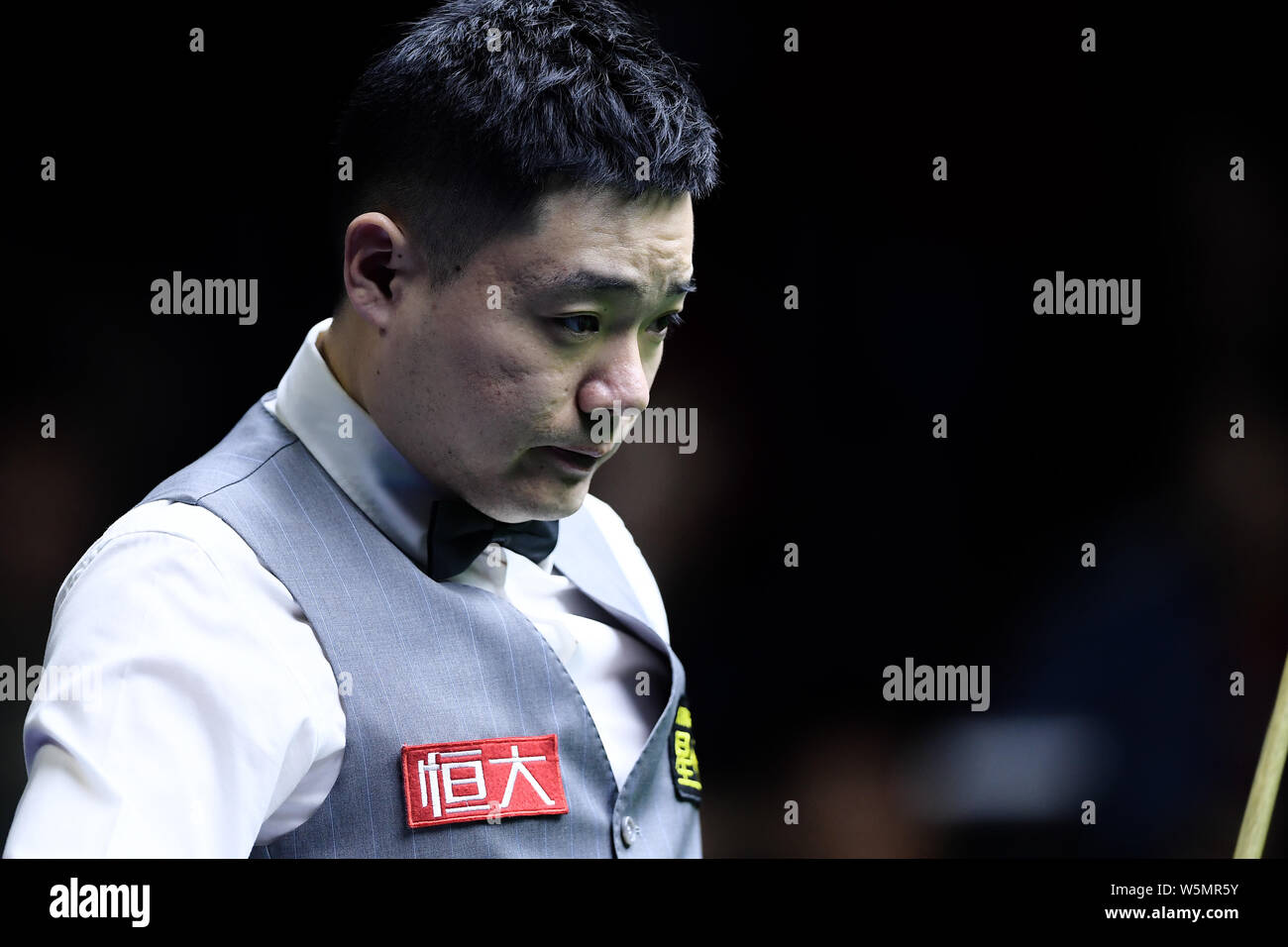 Ding Junhui of China considers a shot to Zhang Jiankang of China in the ...