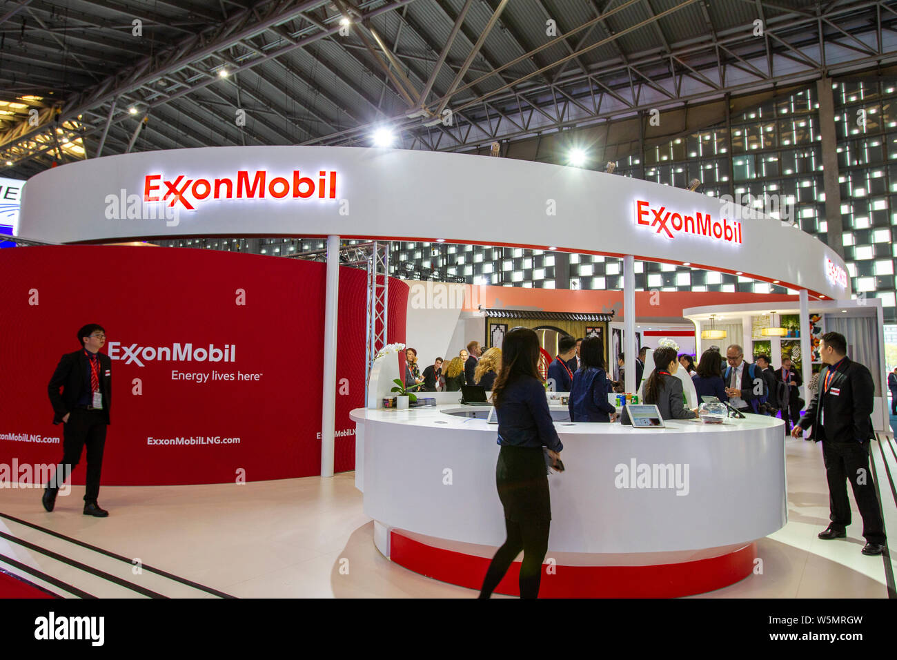 --FILE--People visit the stand of US-based ExxonMobil Corp during an ...