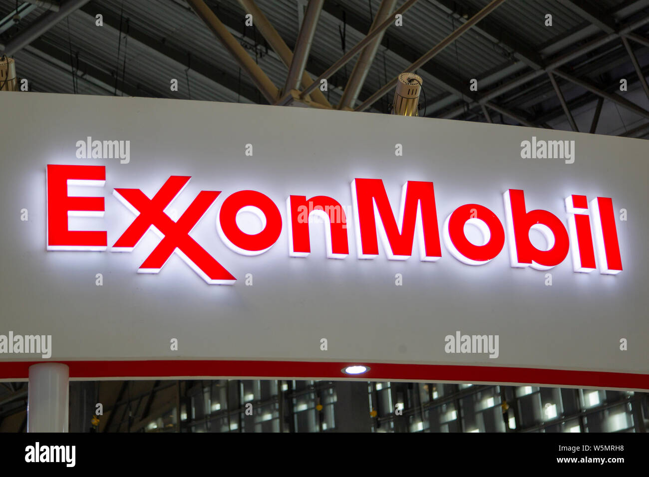 --FILE--People visit the stand of US-based ExxonMobil Corp during an ...