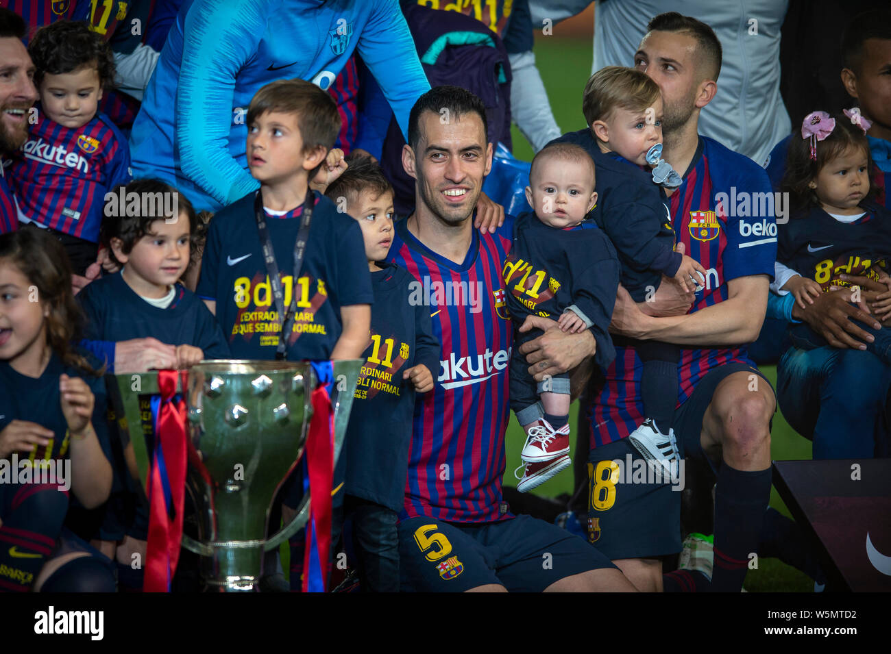 Sergio Busquets, center, and teammates of FC Barcelona pose with their ...