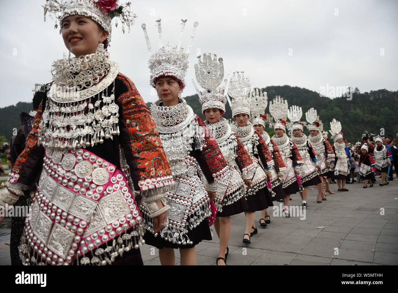 Chinese girls of Miao ethnic group wearing traditional costumes and ...