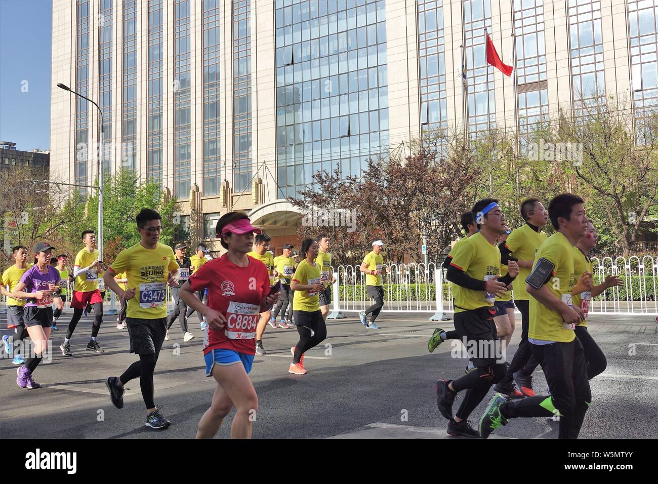 Participants run from the starting line during the 2019 Beijing Half ...