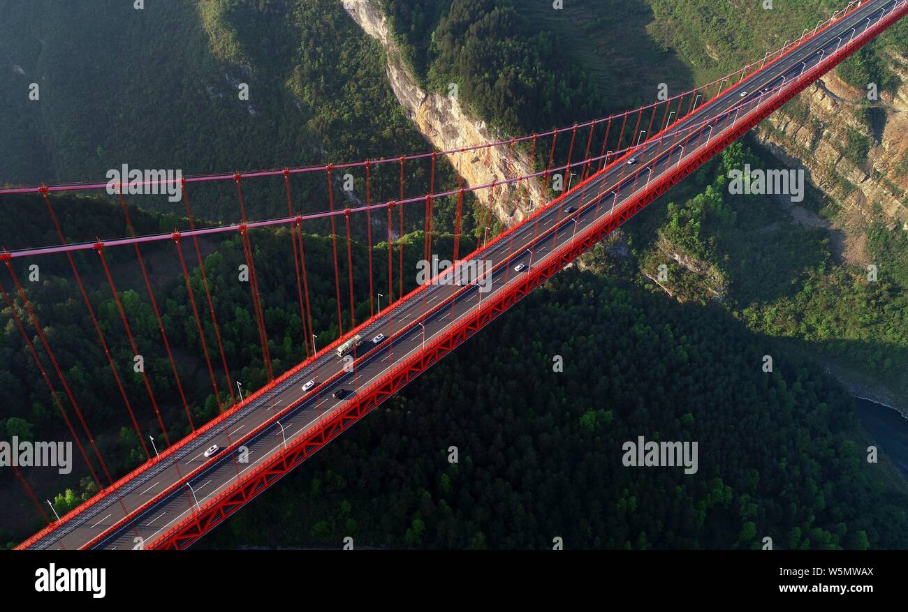 Cars drive on the Qingshui River Bridge, which is third highest ...