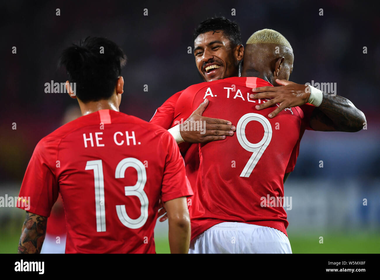 Brazilian football player Paulinho, behind, of China's Guangzhou ...