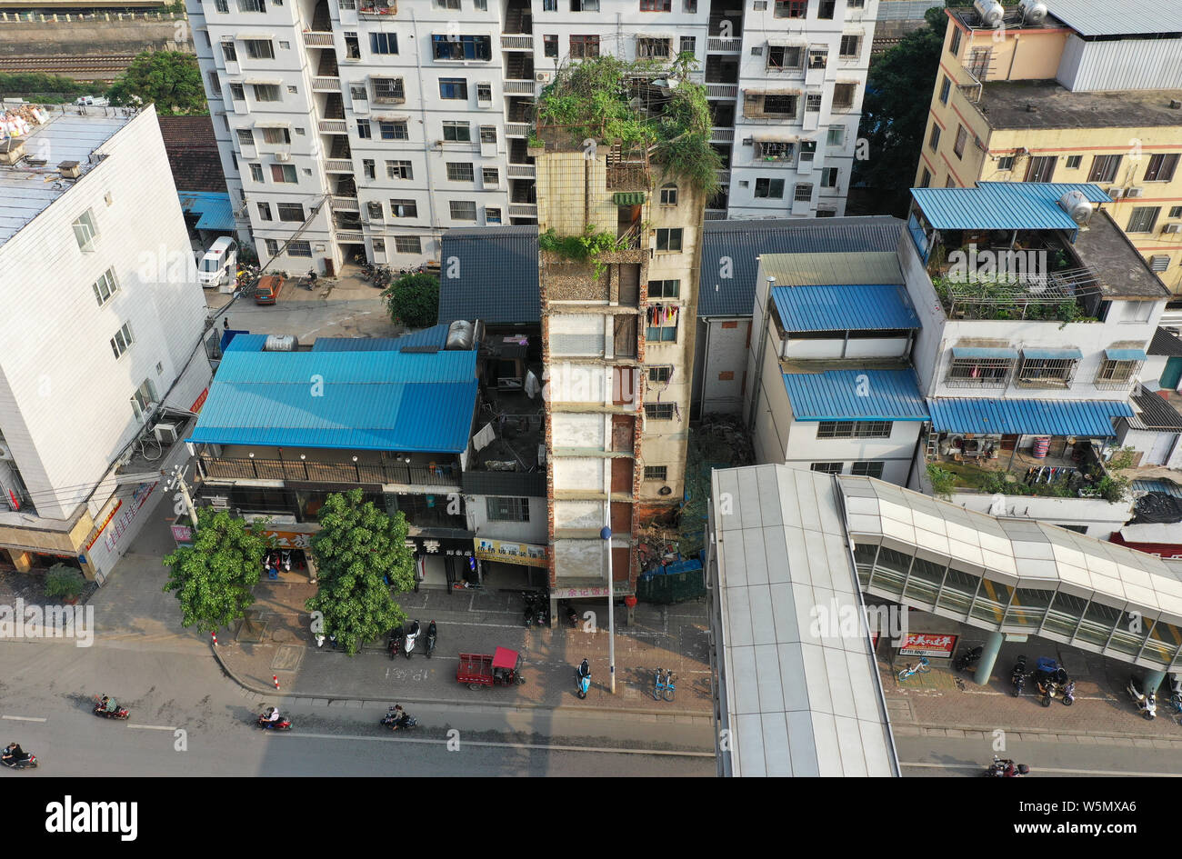 The half-demolished nine-floor residential building is pictured in ...