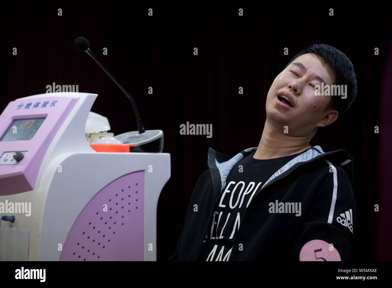 The face of an expectant father contorts as he experiences the pain of ...