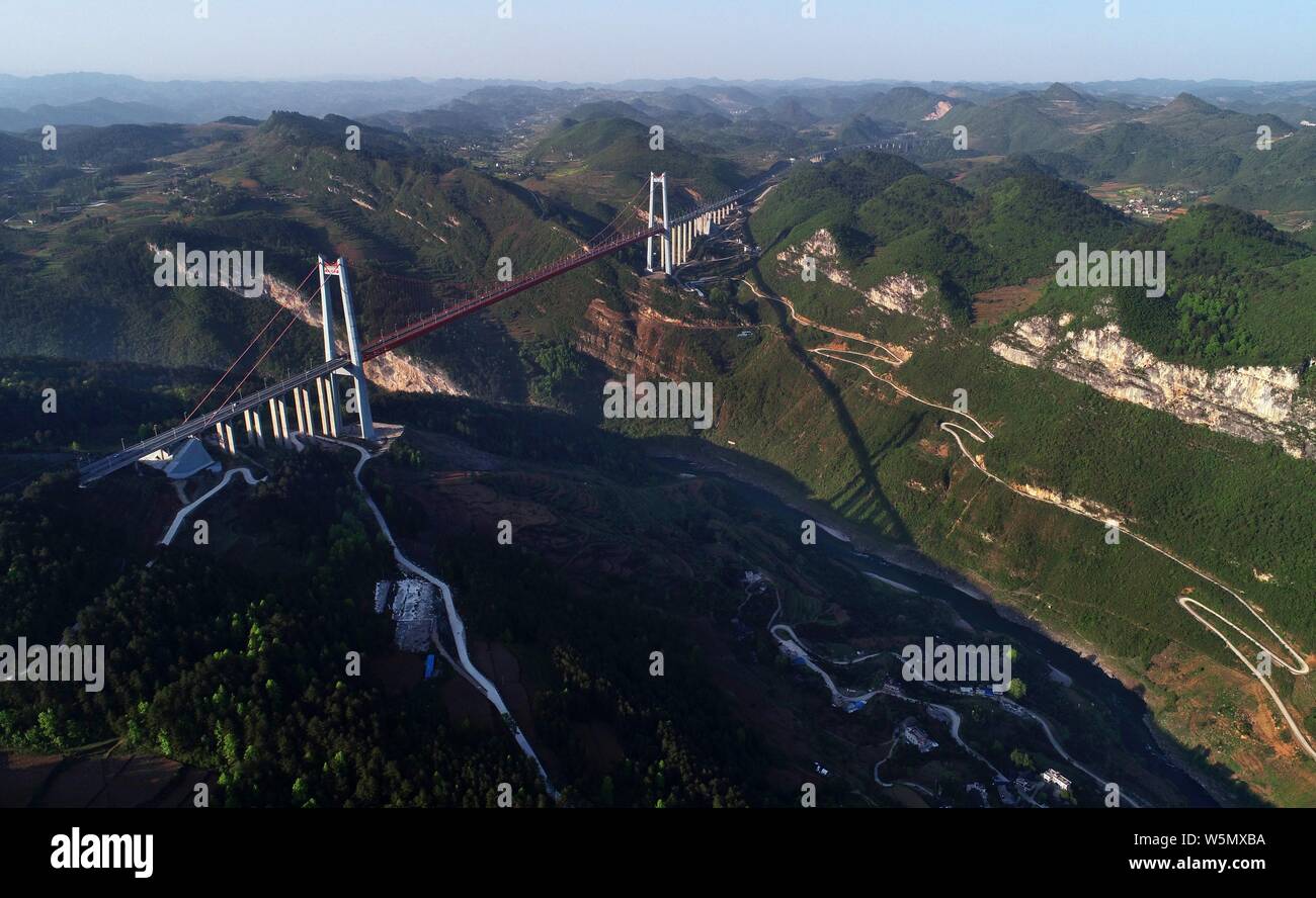 Cars drive on the Qingshui River Bridge, which is third highest ...