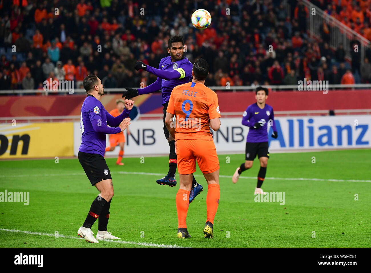 Italian football player Graziano Pelle, right, of China's Shandong ...