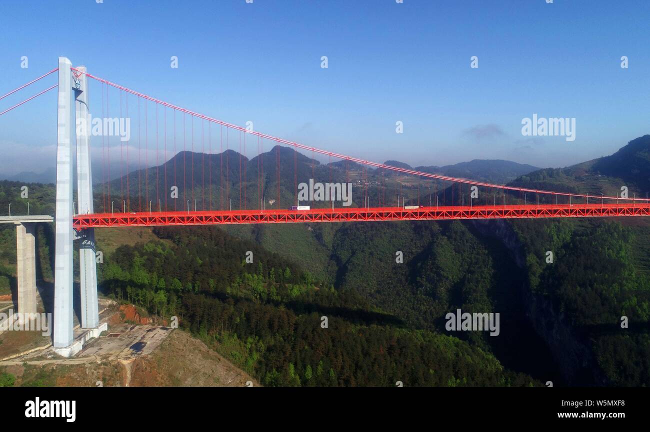 Cars drive on the Qingshui River Bridge, which is third highest ...