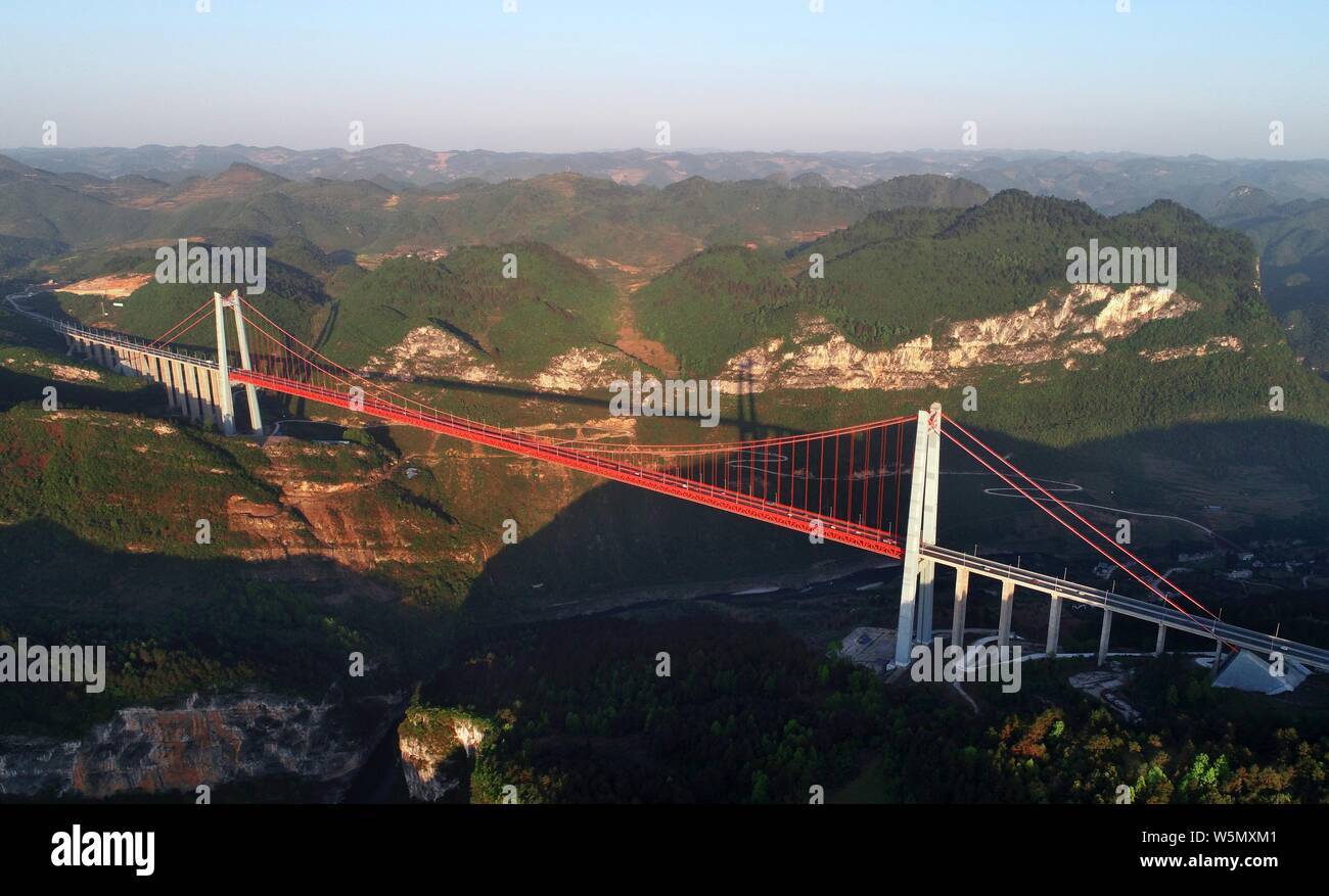 Cars drive on the Qingshui River Bridge, which is third highest ...