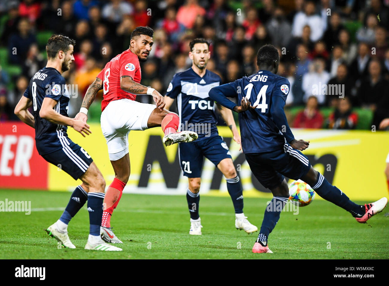 Brazilian football player Paulinho, center, of China's Guangzhou ...