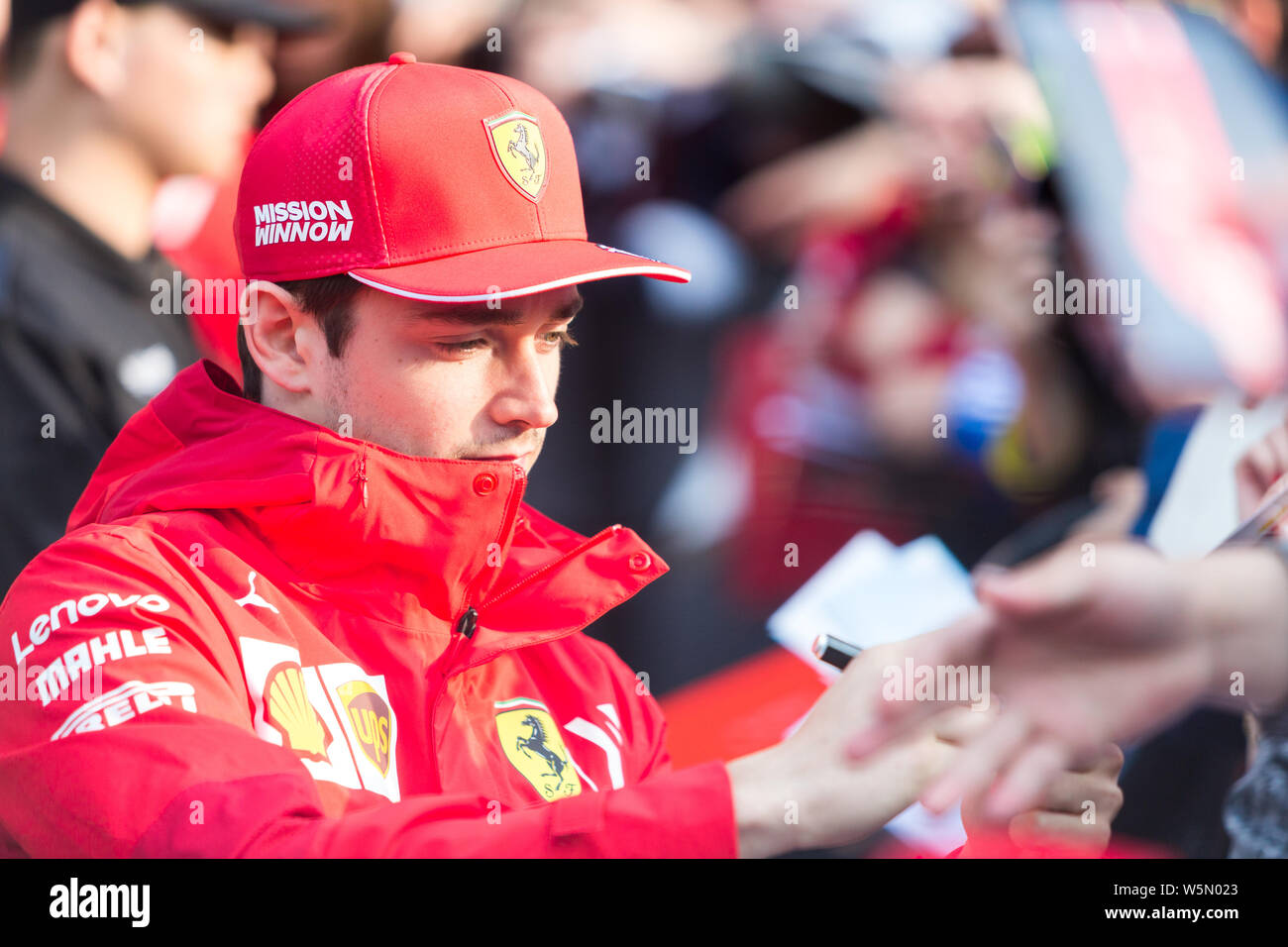 Monegasque racing driver Charles Leclerc of Scuderia Ferrari signs ...