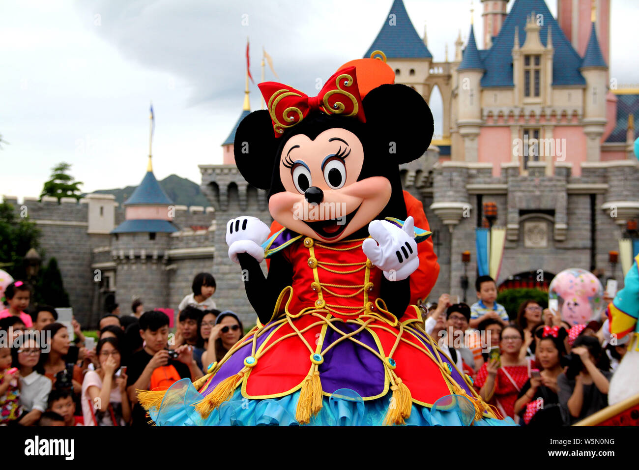 --FILE--An entertainer dressed in the costume of Minnie Mouse performs ...