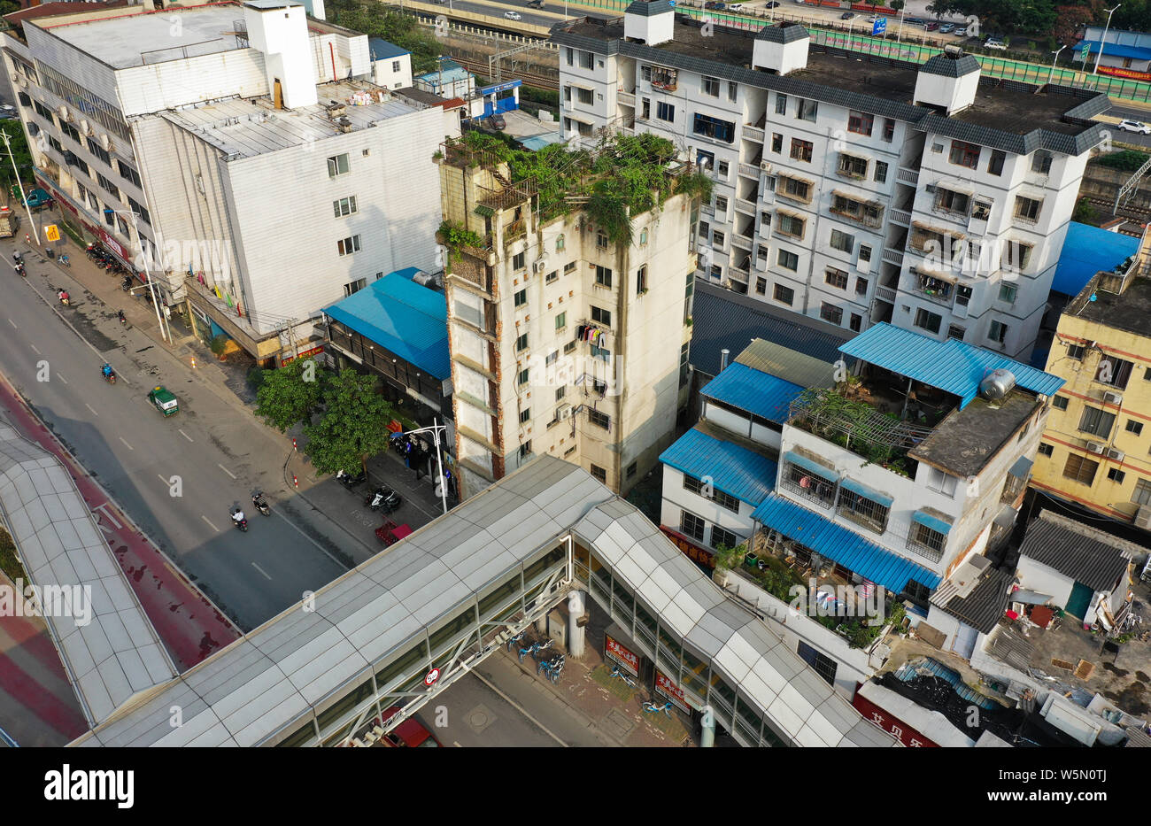 The half-demolished nine-floor residential building is pictured in ...