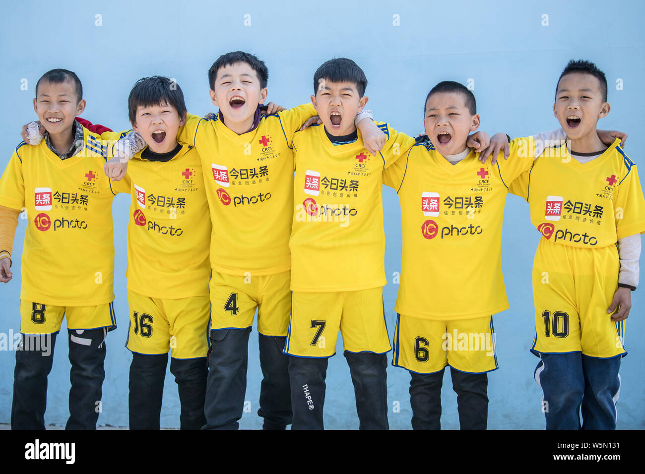 Chinese teenager football players take part in the "CSL's First-name ...