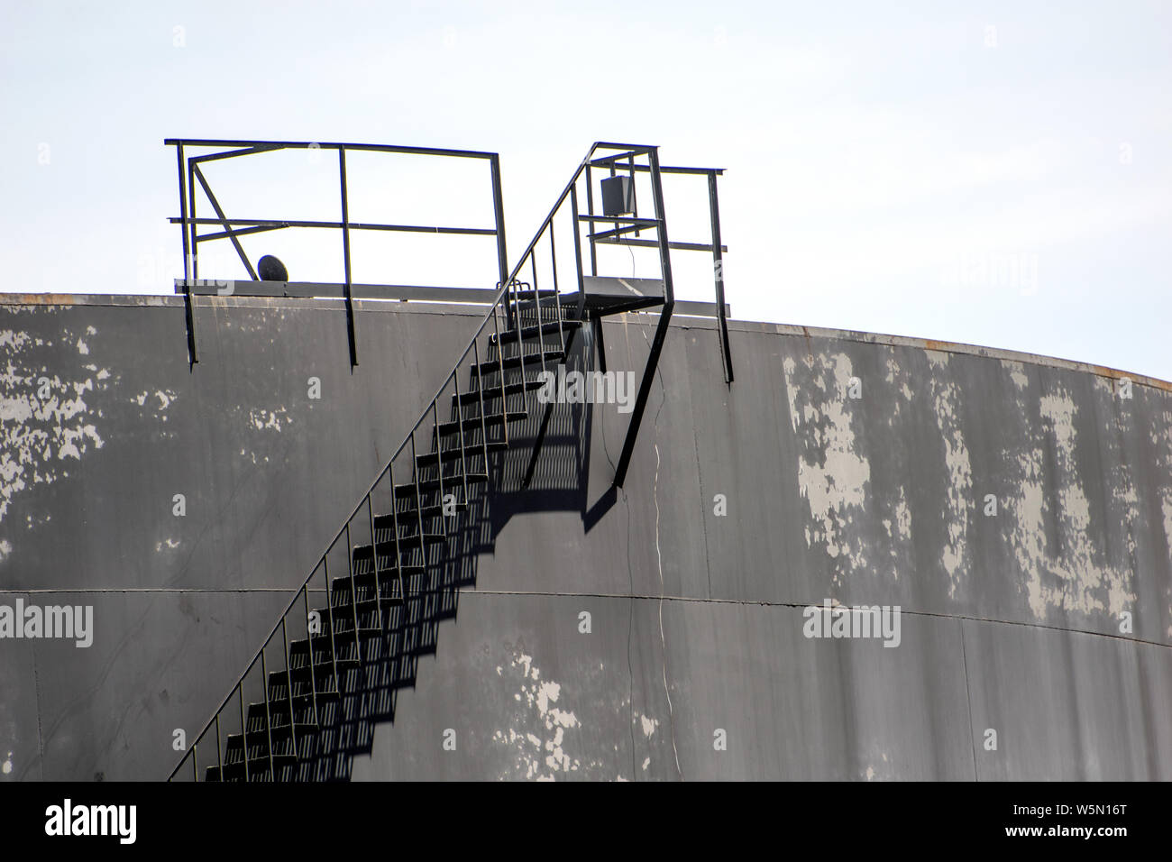 Old fuel tank with staircase Stock Photo - Alamy